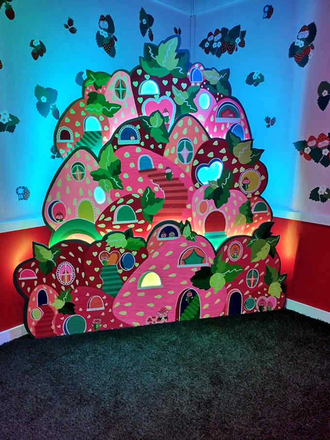 The strawberry village looks like it was designed by a five-year-old with an unlimited budget and a degree in architecture.