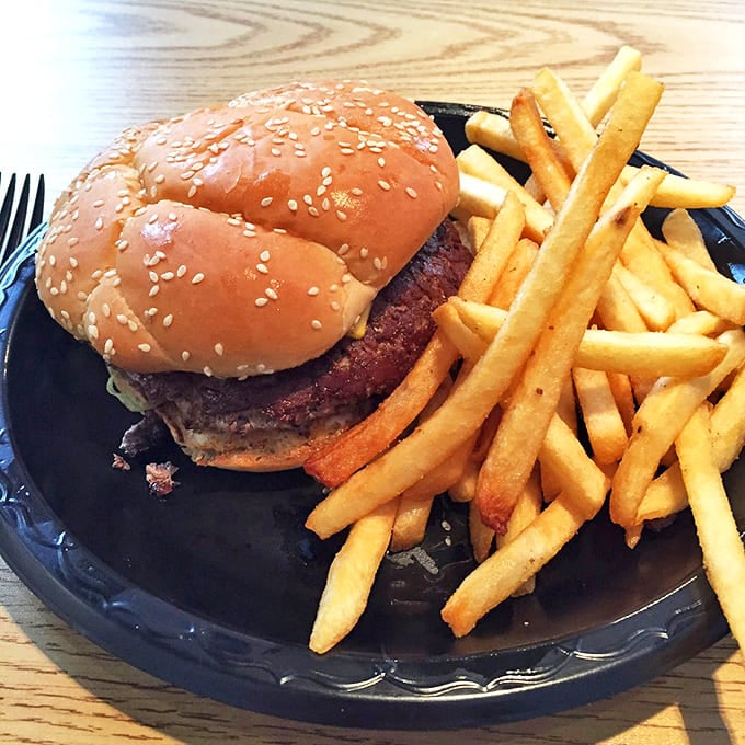A burger that requires both hands and a strategy &ndash; paired with golden fries that make the perfect supporting cast.