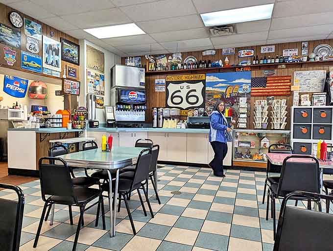 The classic checkerboard floor and simple dining area invite travelers to sit, eat, and share stories of their adventures on America's most famous highway.