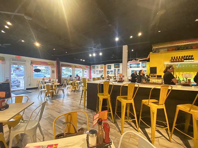 The dining area balances beachy vibes with comfortable seating, creating the perfect backdrop for memorable meals and vacation stories.