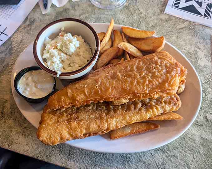 Golden, crispy fish and chips with creamy coleslaw deliver that satisfying crunch we all crave from this classic dish.