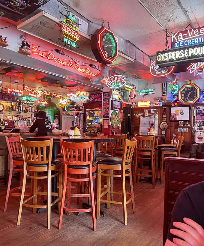 The dining area glows like a jukebox had a baby with a beer sign museum, and honestly, we're here for it.