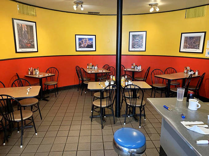 The dining area's warm color scheme creates the perfect backdrop for morning conversations and the serious business of breakfast enjoyment.