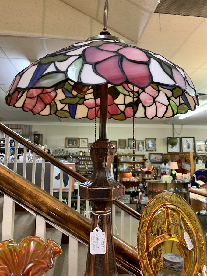 Stained glass flowers bloom eternally in this Tiffany-style lamp, casting colorful shadows that no smartphone light could ever hope to replicate.
