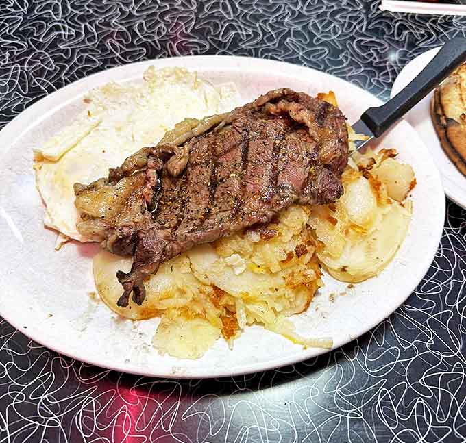 Steak and eggs &ndash; the breakfast of champions, with a perfectly grilled cut resting on a bed of those legendary hash browns.