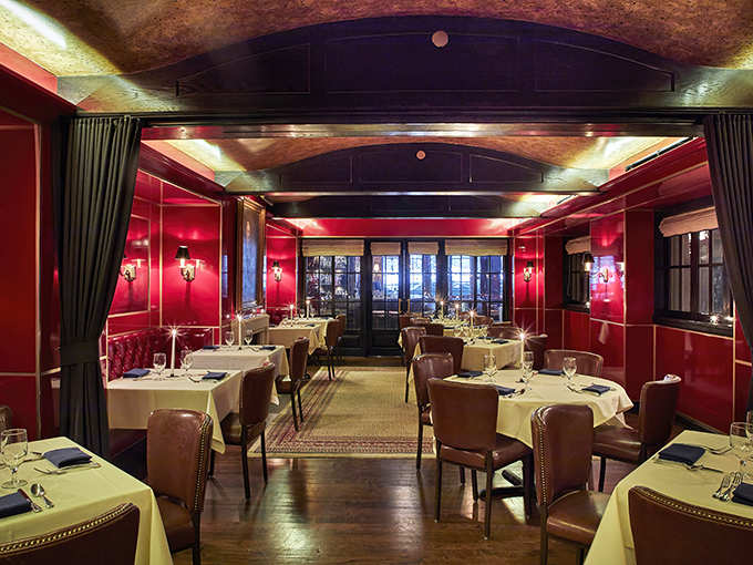 The dining room's crimson walls and white tablecloths create the perfect backdrop for memories waiting to be made.
