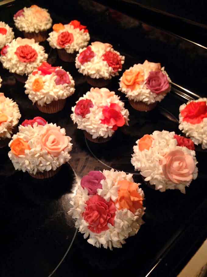Cupcakes topped with buttercream flowers that look like they belong in a garden, not your stomach.
