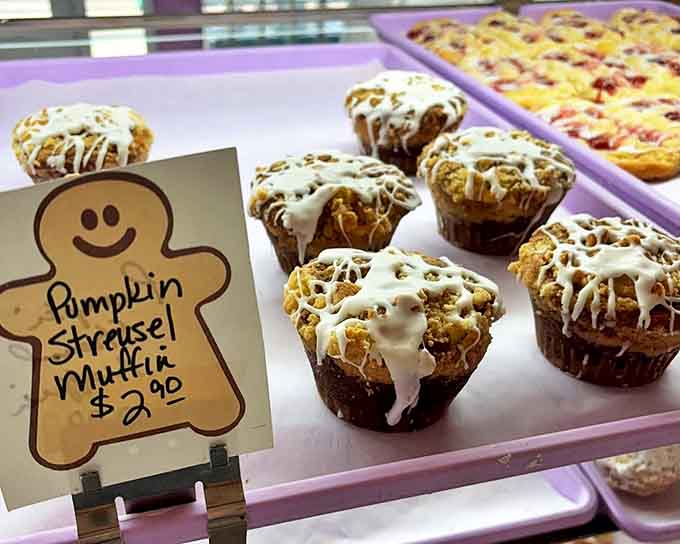 Pumpkin streusel muffins with crowns so perfect they deserve their own tiny coronation ceremonies.