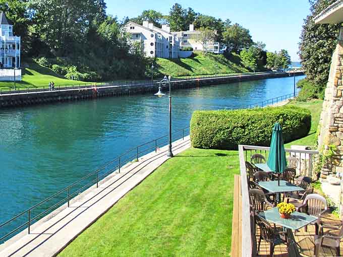 Imagine sipping morning coffee here, watching boats glide through Charlevoix's channel while contemplating absolutely nothing important.
