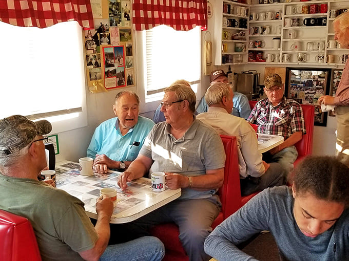 The dining area invites lingering conversations over donuts, where strangers become friends and calories mysteriously don't count.