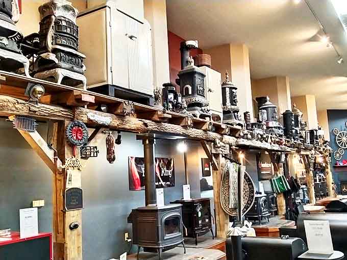 Antique stoves line up like soldiers from different eras, their cast iron bodies and ornate details showcasing the evolution of American cooking technology.
