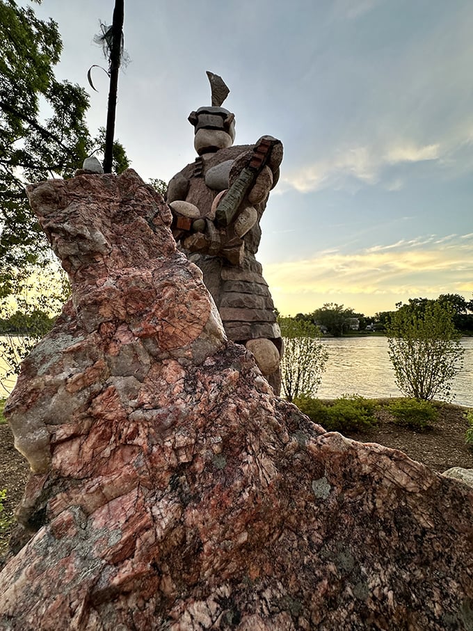 Sunset casts long shadows from the guardians, creating a magical atmosphere as day transitions to evening.