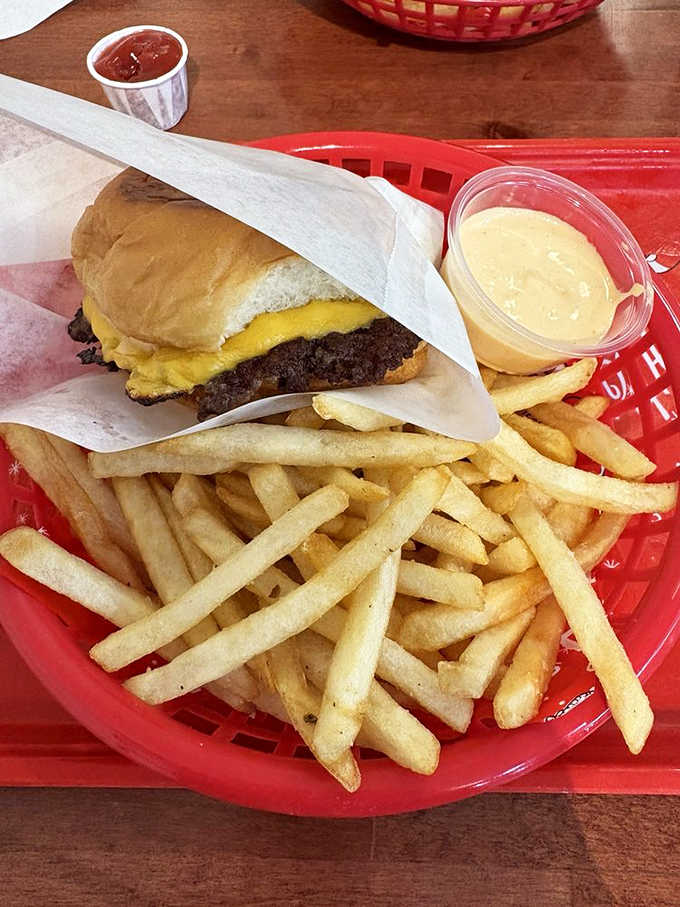 A proper cheeseburger doesn't need fancy tricks &ndash; just the perfect ratio of beef to cheese to bun, with fries standing by for moral support.