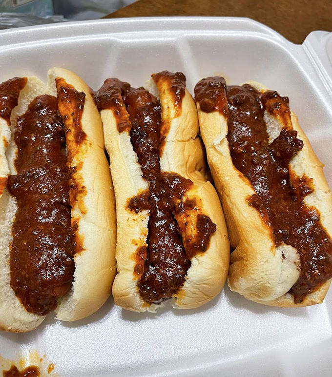 The chili carne dogs arrive with a rich, meaty sauce that clings lovingly to each frankfurter &ndash; a spicy-sweet relationship made in culinary heaven.