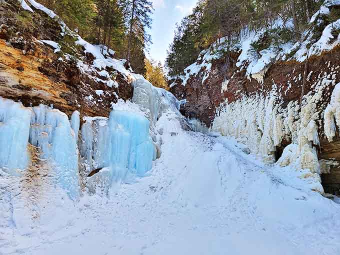 Ice clings to the rock face like nature's own crystal chandelier, creating a winter spectacle that's worth braving the cold and questionable footwear choices.
