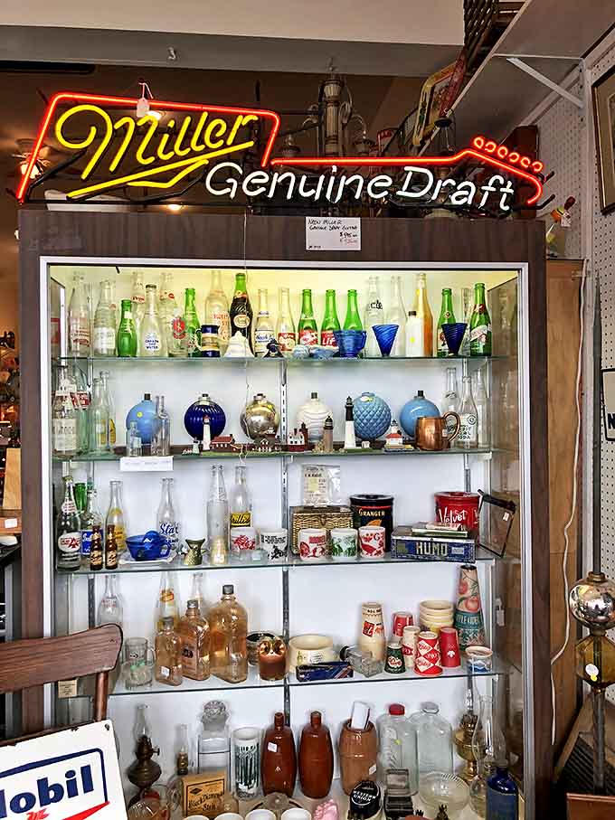 The neon glow of vintage beer signs illuminates shelves of collectible bottles &ndash; from soda pop classics to forgotten local Michigan brands.