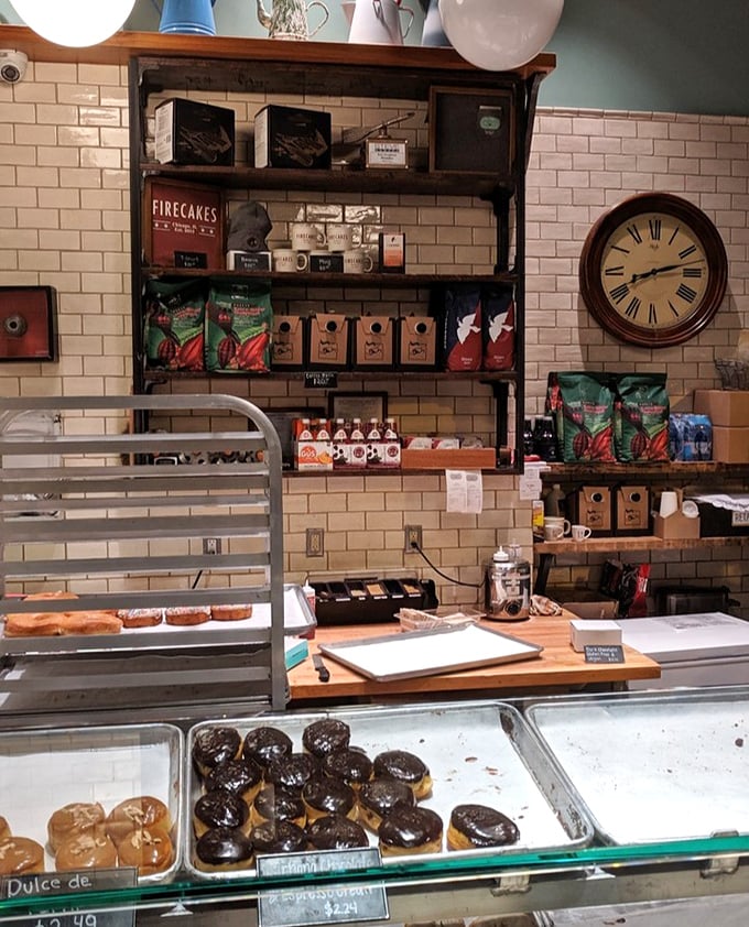 Behind the counter, where donut magic happens daily&mdash;shelves lined with quality ingredients waiting to become tomorrow's first bite of joy.