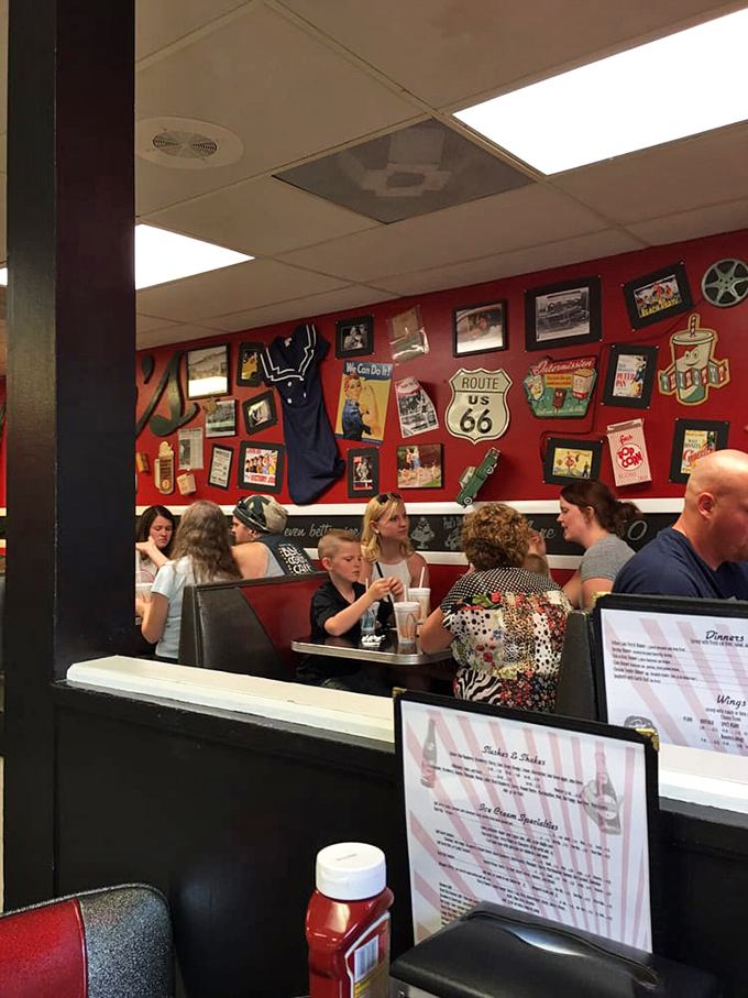 Families and friends gather in these booths to share not just meals but moments, continuing traditions that span generations in this beloved local spot.