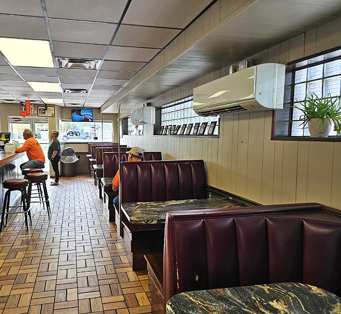 The classic interior features worn-in booths and counter seating where countless stories have been shared over legendary loose meat sandwiches.