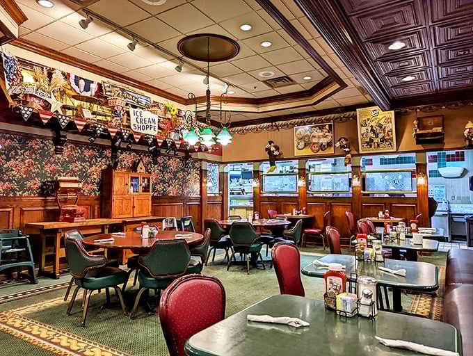The main dining room buzzes with conversation as patrons enjoy hearty meals under the watchful gaze of American flags and vintage decor.
