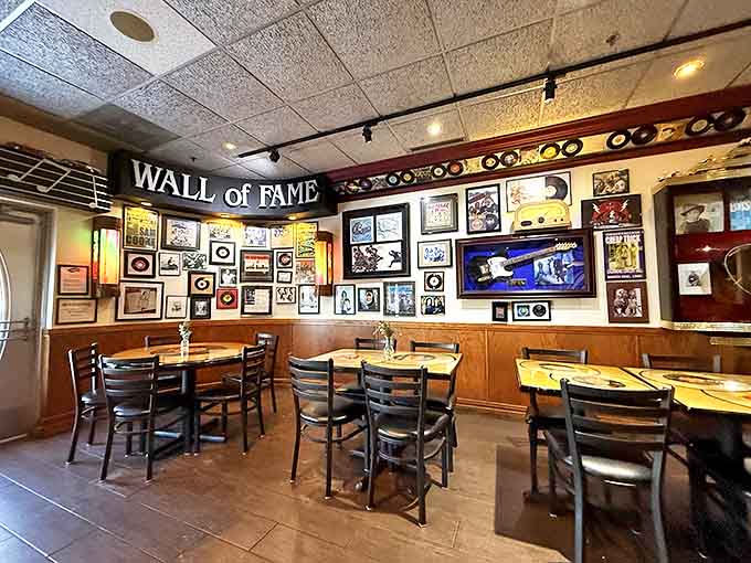 The Wall of Fame watches over diners like musical guardian angels, blessing every bite with rock and roll spirit.