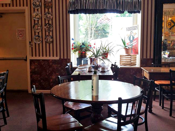 Vintage-inspired dining areas with striped wallpaper and railroad memorabilia transport guests to a simpler time when meals were events.