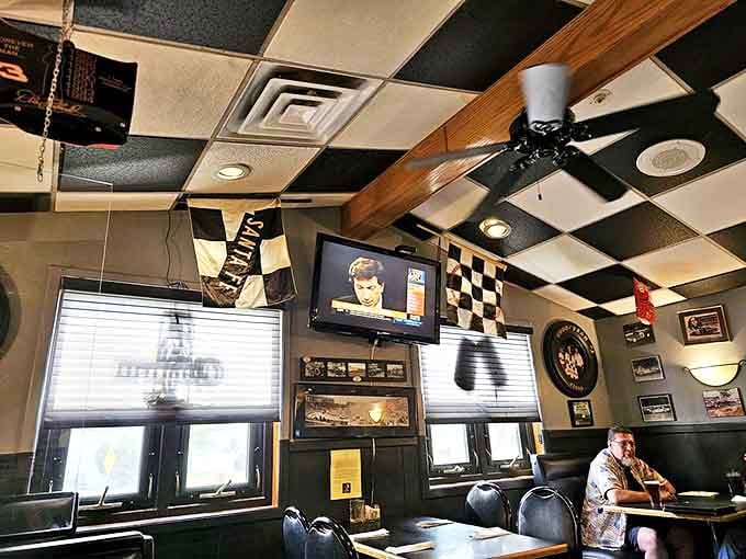 The dining room's checkered ceiling and racing memorabilia create an immersive experience that makes even waiting for your food feel like pre-race excitement.