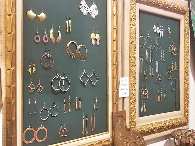 Framed displays of vintage earrings transform jewelry into art, the varied designs reflecting changing fashions through the decades.