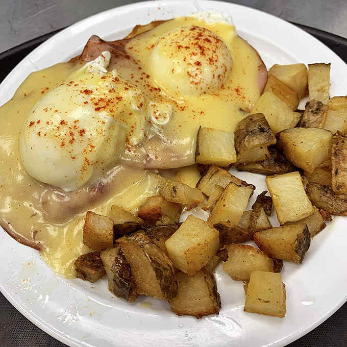 Eggs Benedict that would make a banker weep with joy &ndash; perfectly poached eggs on a throne of Canadian bacon, crowned with hollandaise.