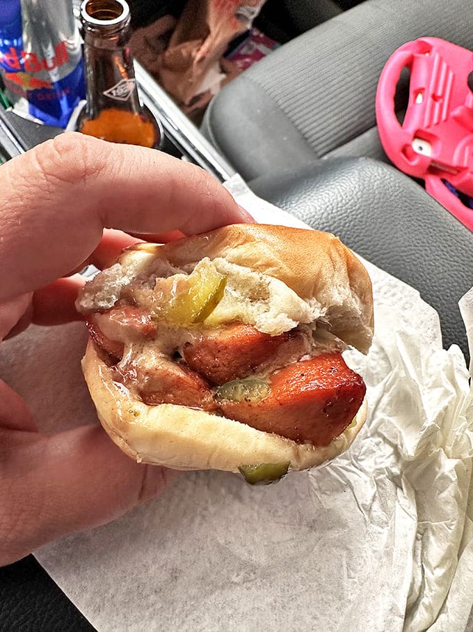 Not just a burger joint! Crabill's hot dogs get the same loving treatment, nestled in a soft bun with pickle for that perfect tangy contrast.