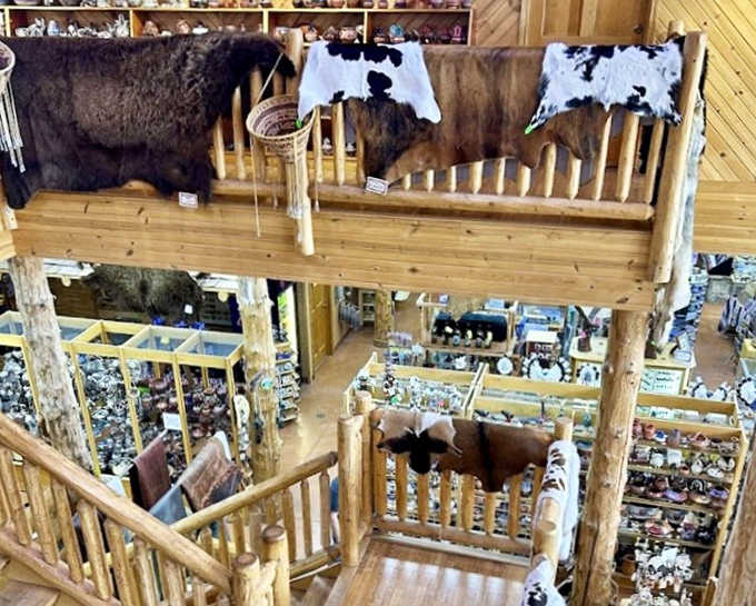 From the mezzanine level, animal hides and textiles create a visual tapestry of artistic heritage, while offering a bird's-eye view of treasures below.