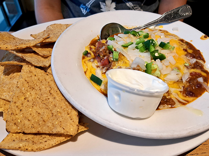 A mountain range of tortilla chips blanketed in melted cheese that will have you strategically positioning the plate to favor your side.