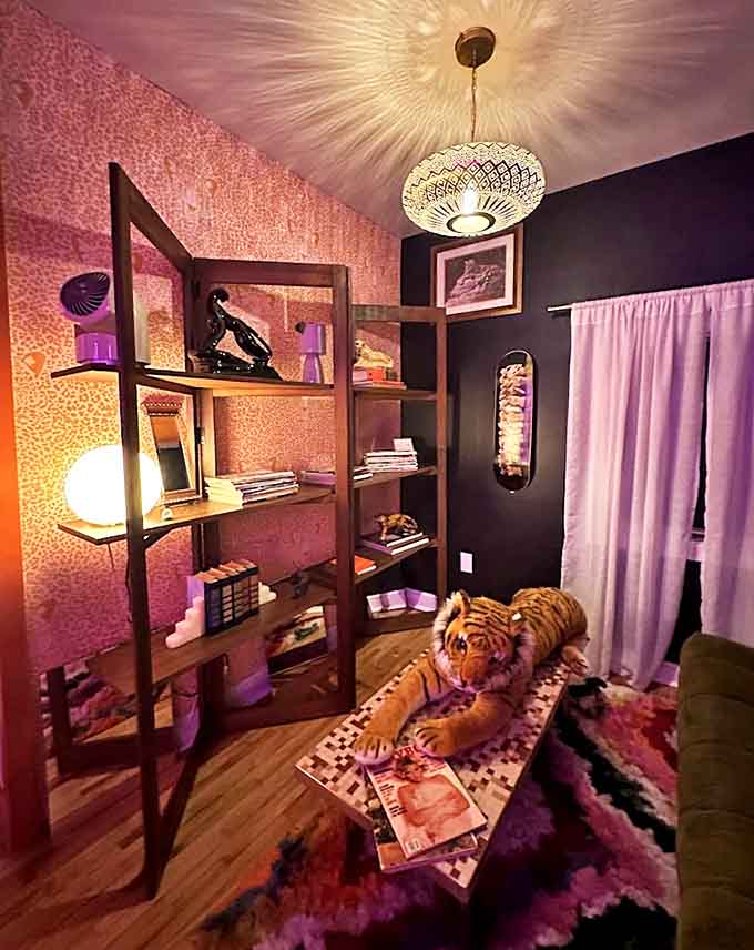 This reading nook isn't just comfortable &ndash; it's a technicolor literary escape where even the stuffed tiger seems engrossed in the curated selection of books.