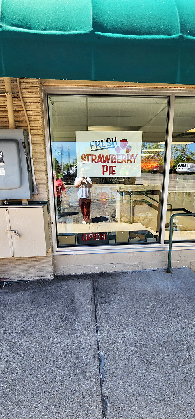 The "Fresh Strawberry Pie" sign works better than any siren song, luring passersby with promises of summer captured in a crust.