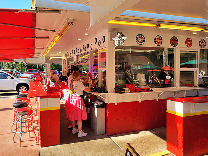 Behind those service windows, the staff orchestrates burger magic with the kind of efficient rhythm that would make any symphony conductor slightly jealous of their coordination.