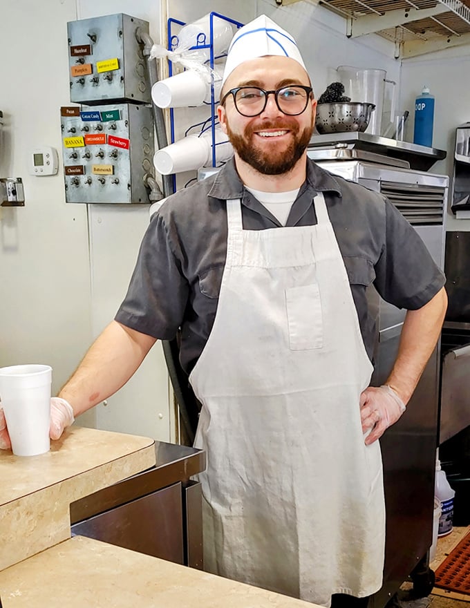 Behind the counter, culinary magic happens with practiced precision &ndash; no wasted motions, just burger craftsmanship at its finest.