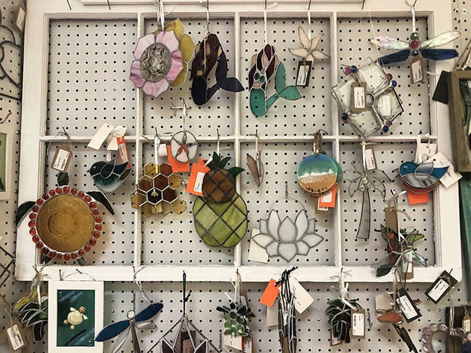 Stained glass ornaments catch the light like tiny kaleidoscopes, transforming ordinary sunshine into rainbow magic that would make any window infinitely more interesting and beautiful.