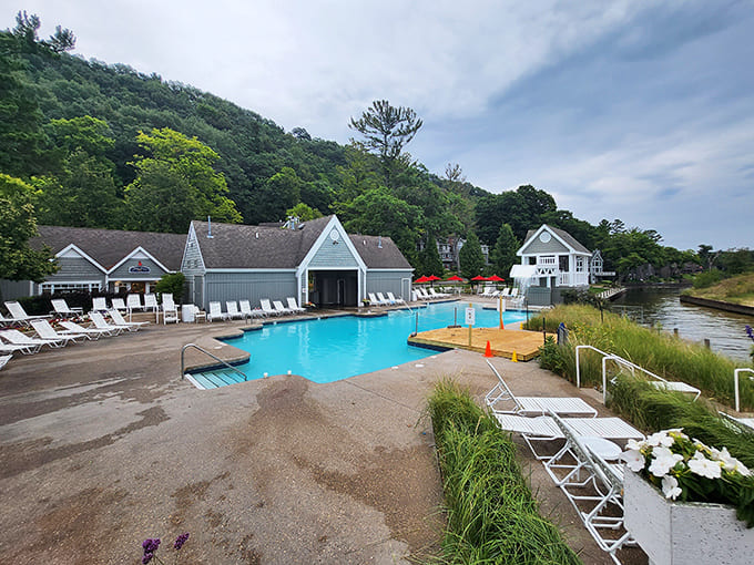 Resort living at its finest: a curved pool nestled against lush greenery, where "doing nothing" becomes an art form worth mastering.