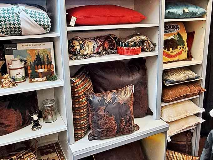 Decorative pillows with wildlife motifs and rustic designs stand ready to add the finishing touch to cabins, lake homes, or city apartments.