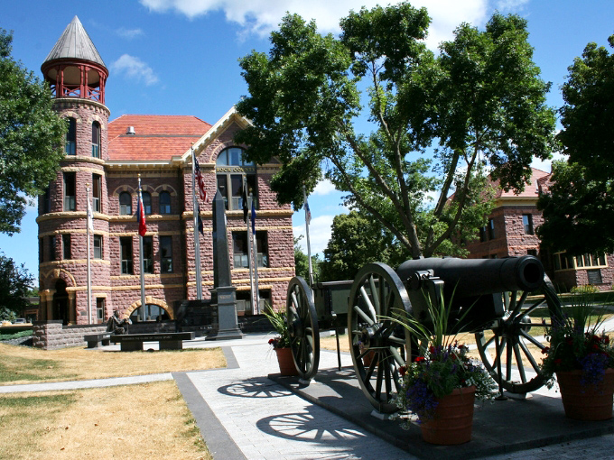 The Rock County Courthouse stands proud in Sioux quartzite splendor, its tower watching over generations of local history.