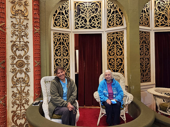 The vintage train rolls smoothly along brick-paved tracks, its warm wooden interior and gentle sway bringing to life commutes from a century ago.