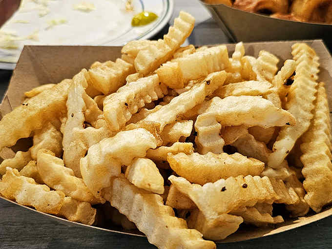 Golden, crispy, hand-cut potato perfection &ndash; these aren't just fries, they're the supporting actors that deserve their own standing ovation.