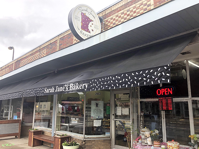 Sarah Jane's Bakery's distinctive Minnesota-shaped sign proudly displays its local roots and commitment to community.