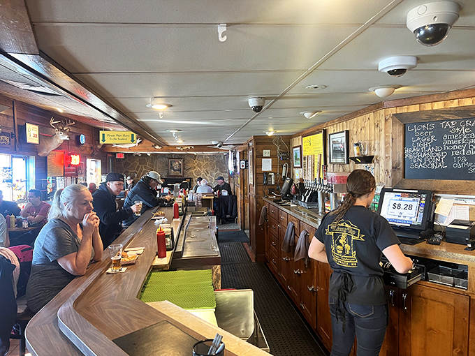 The bar area offers front-row seats to the efficient choreography of a team that's mastered the art of burger perfection.