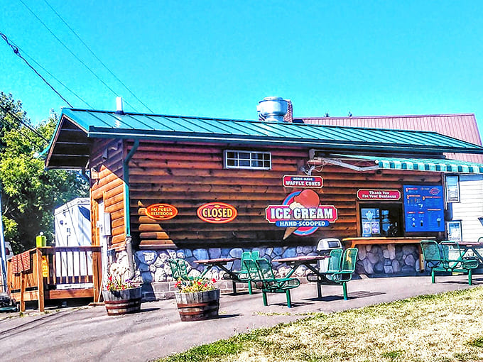 Exterior: Rustic log cabin charm meets ice cream paradise at 5th Street Malt Shoppe, where the "CLOSED" sign only makes you pray harder it's your lucky day.