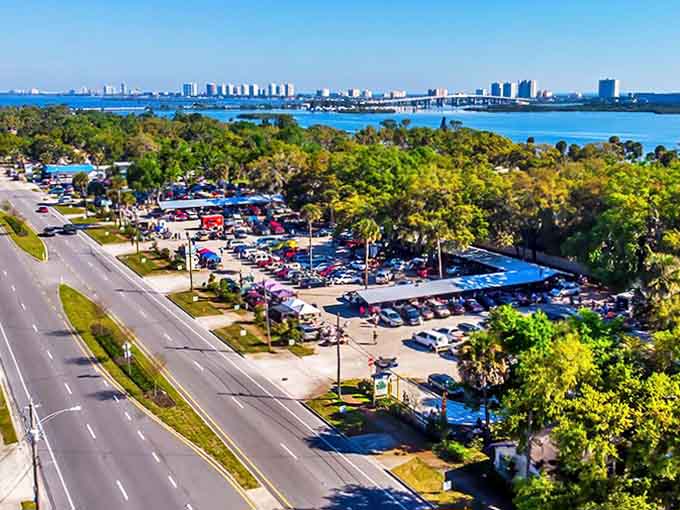 All Aboard Flea & Farmers Market stretches along the Intracoastal Waterway, a treasure hunter's paradise with Daytona Beach's skyline shimmering in the distance.
