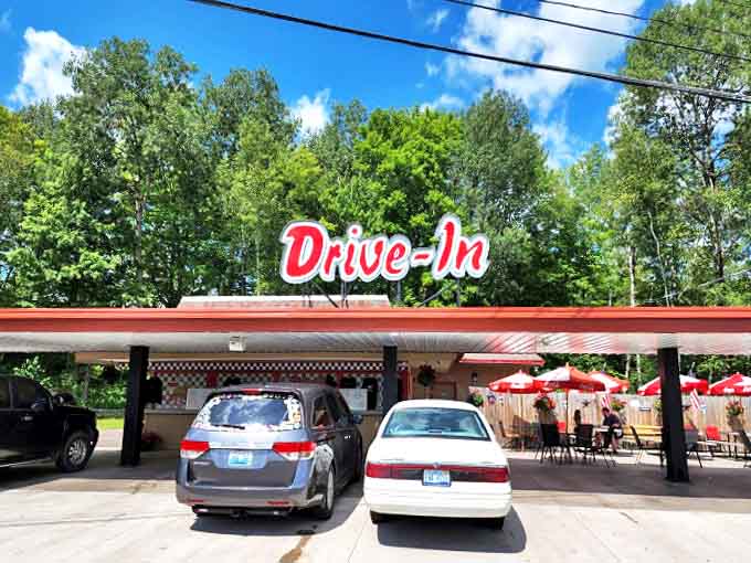 The iconic red "Drive-In" sign welcomes hungry travelers like a beacon of hope for empty stomachs and nostalgic hearts.