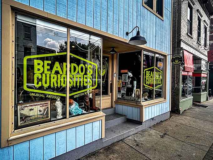 The eye-catching blue exterior of Beardo's Curiosities beckons passersby with its neon-green signage, promising unusual treasures within Cincinnati's most eccentric shopping experience.