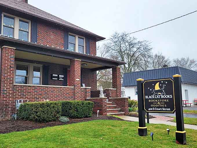 The charming brick exterior and whimsical signage hint at literary magic within, like a book cover that promises adventure before you crack the spine.