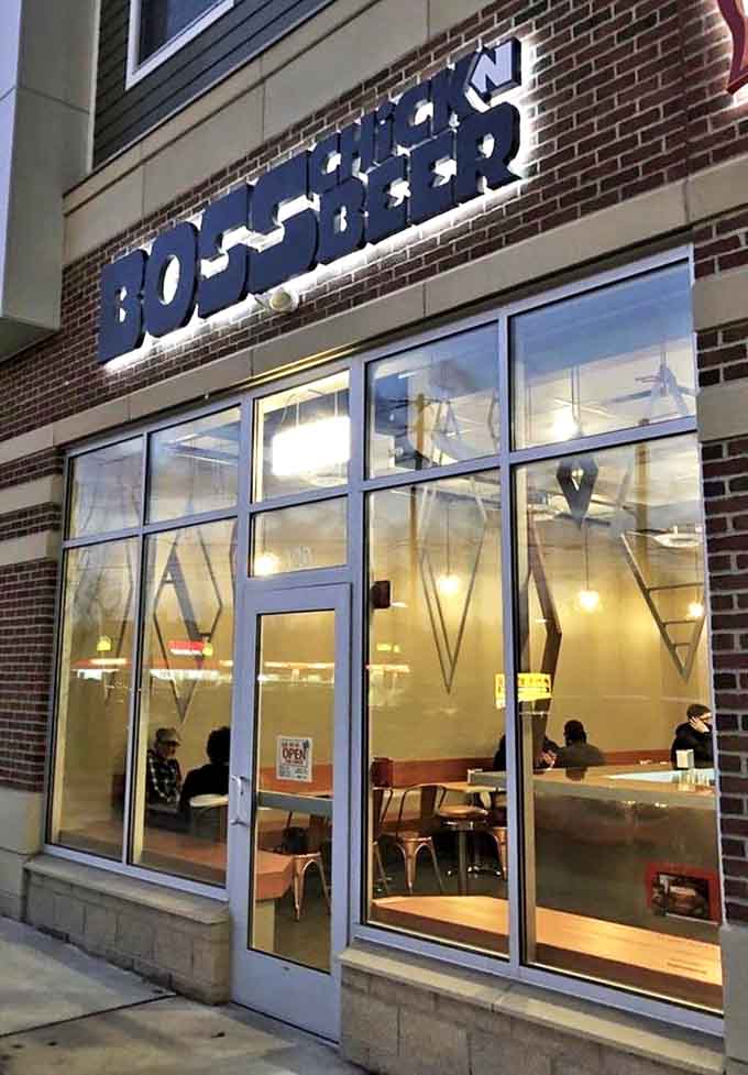 The glowing Boss Chick N Beer sign beckons hungry travelers like a crispy chicken lighthouse in the night.